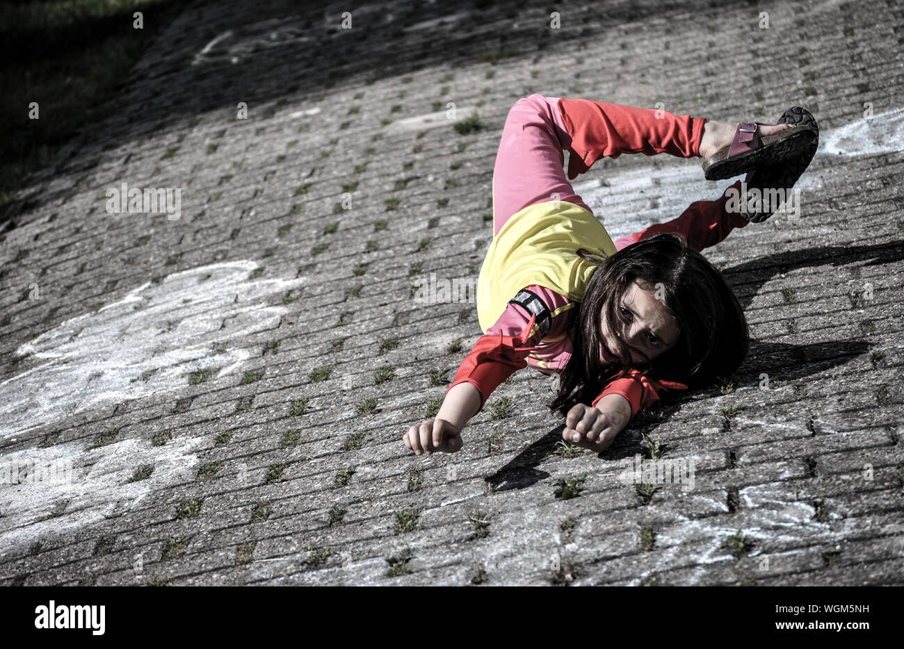Girl lying down on street hi-res stock photography and images - Alamy
