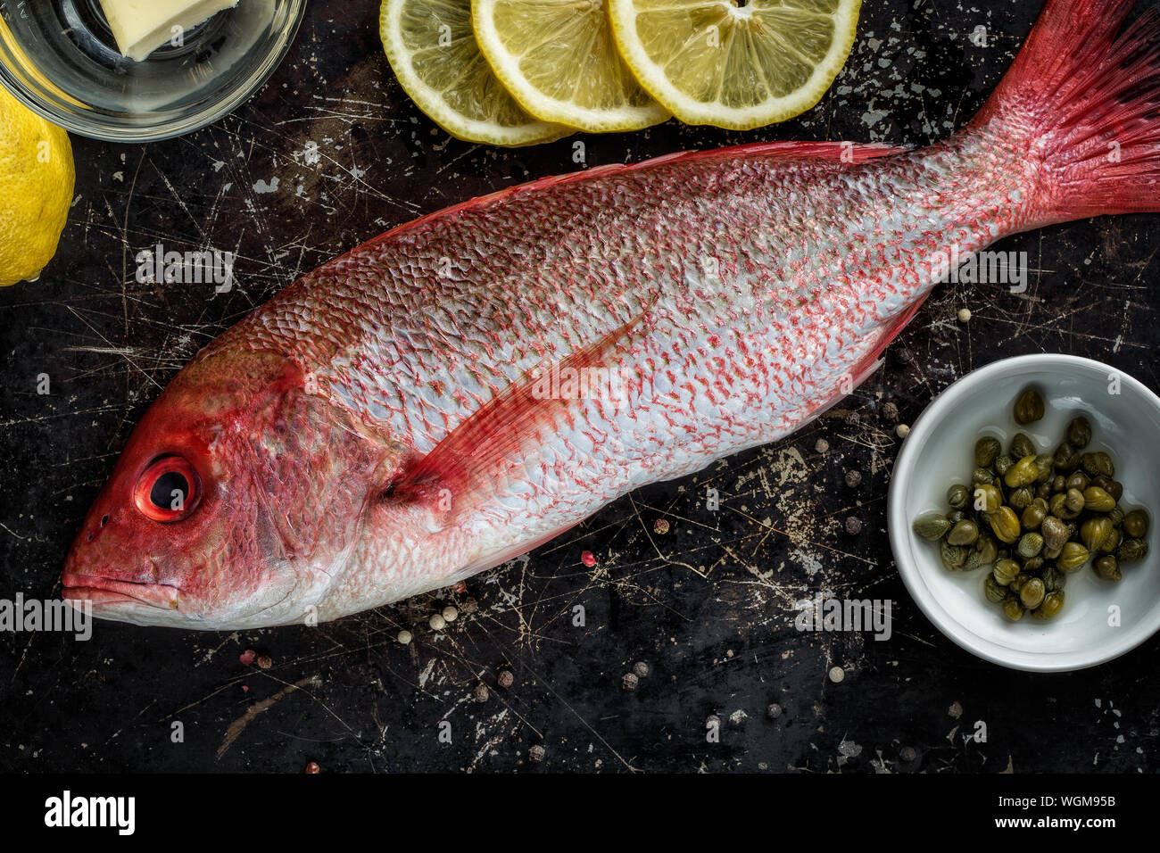 Red snapper with ingredients for lemon caper butter sauce Stock Photo ...