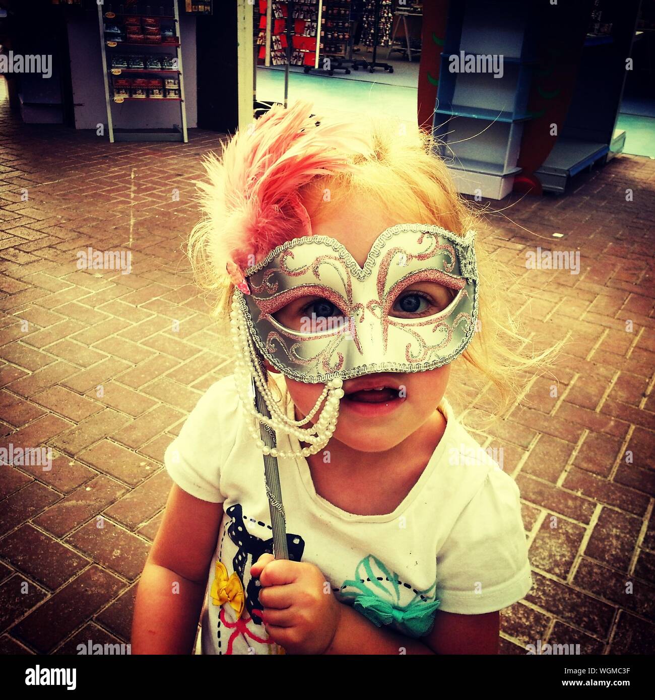 Holding mask over his face hi-res stock photography and images - Alamy