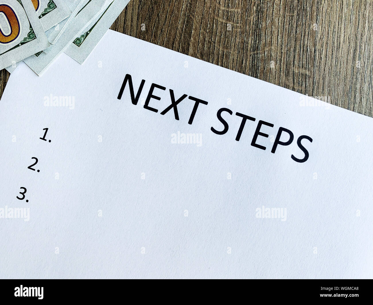 Clipboard with text next step on wood desk Stock Photo - Alamy