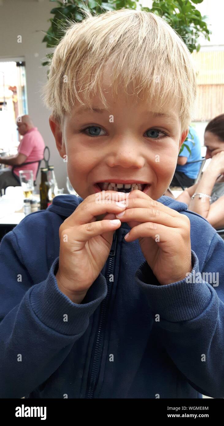 Boy biting food hi-res stock photography and images - Alamy
