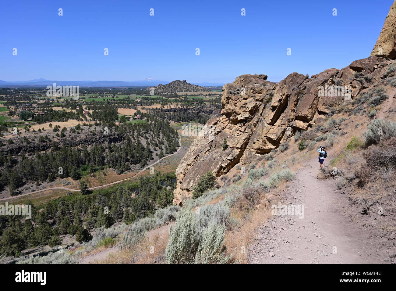 Woman hikes and photographs Misery Ridge Trail in Smith Rock State Park ...