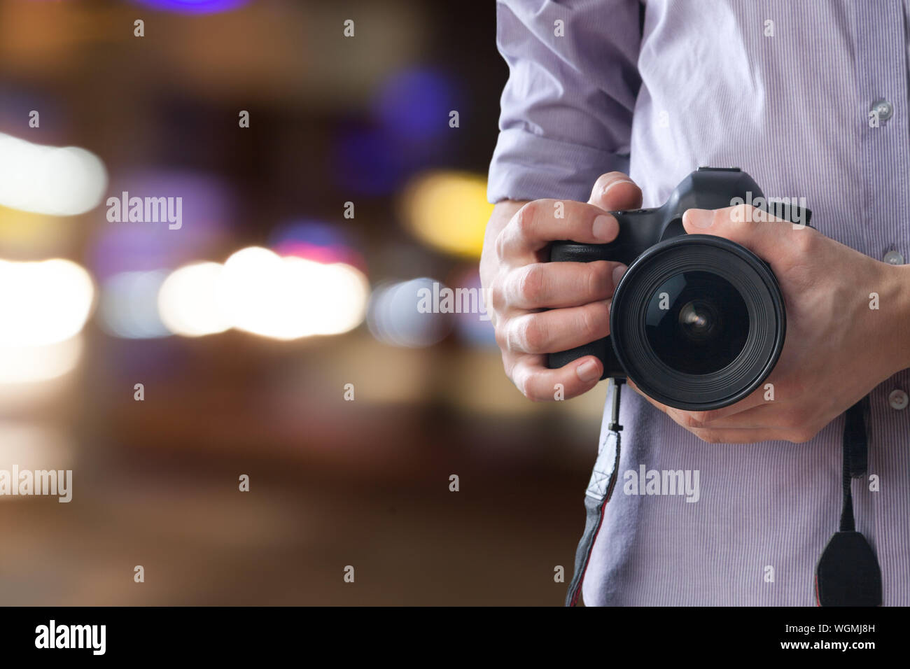 Young black man holds camera hi-res stock photography and images - Alamy