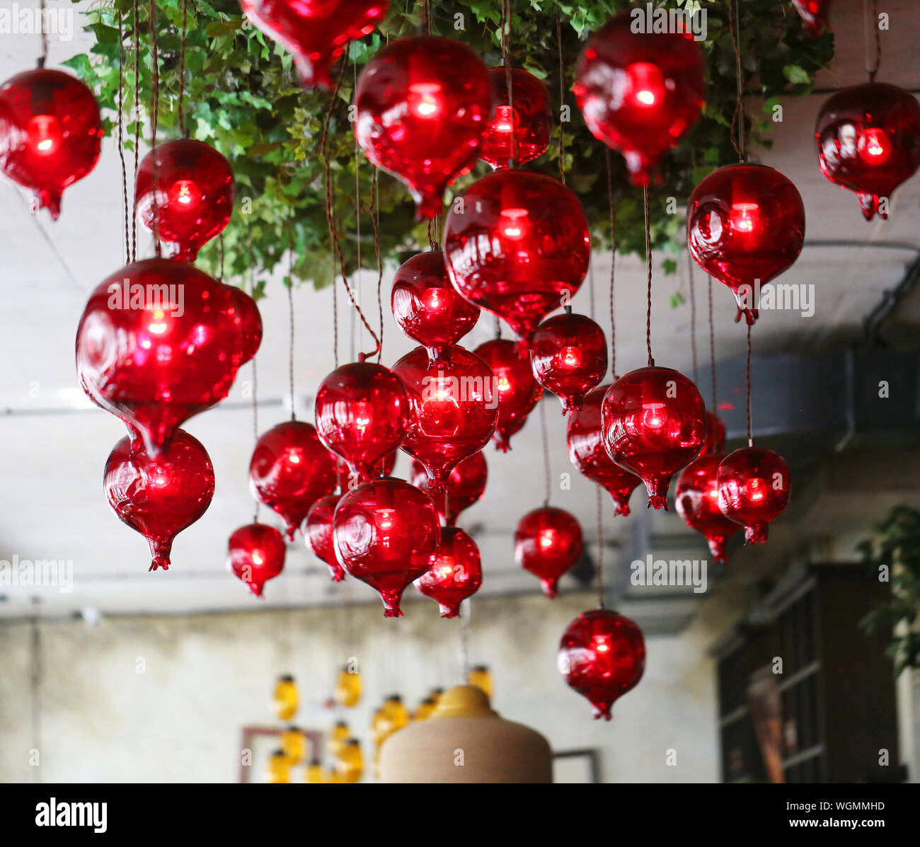 Beautiful red lights in the restaurant on the ceiling photographed ...
