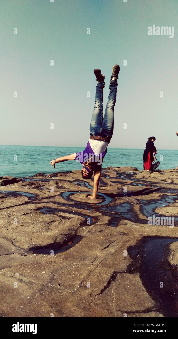 Man doing handstand water hi-res stock photography and images - Alamy