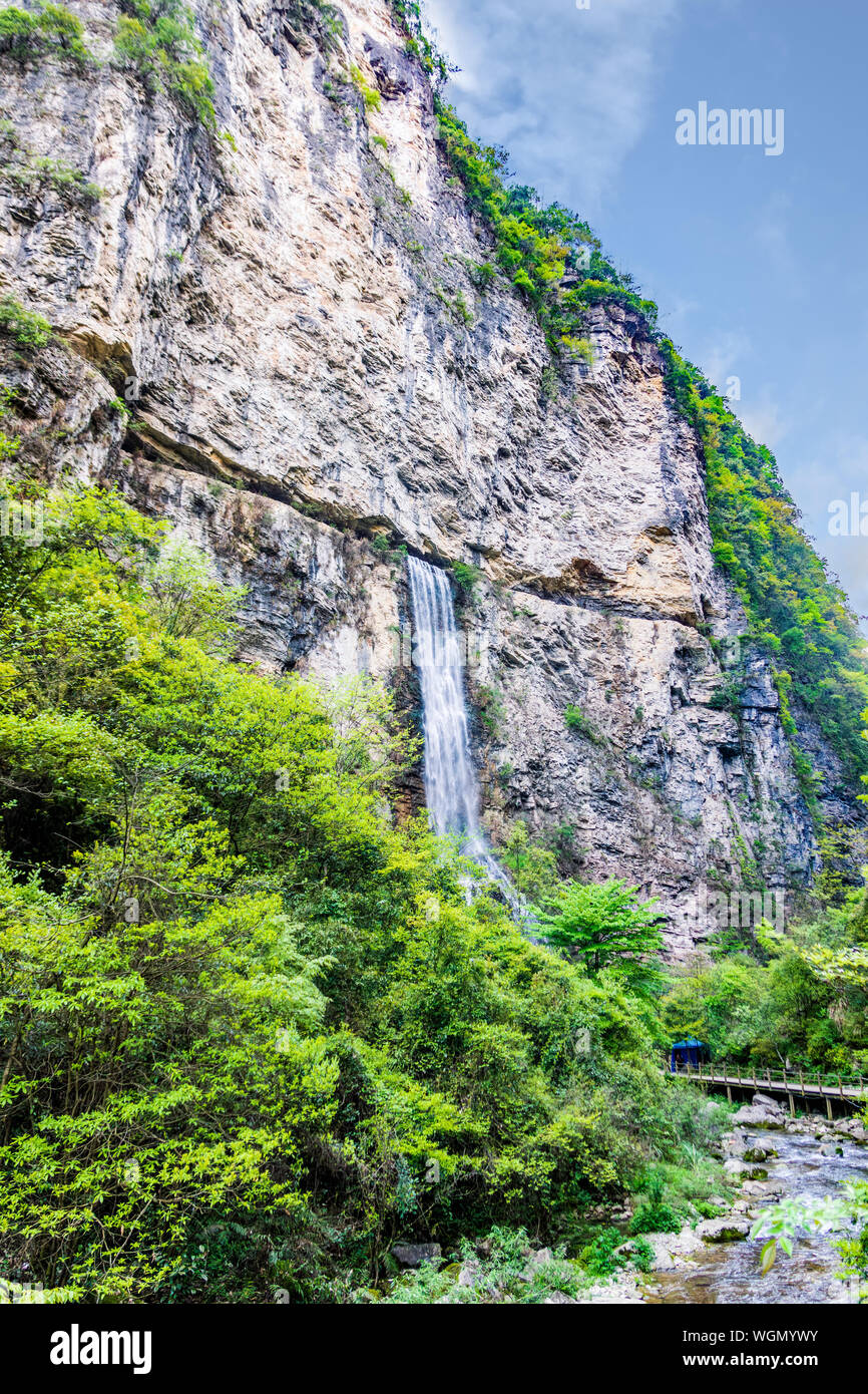 High waterfall falling down from narrow cave in Zhangjiajie in Grand ...