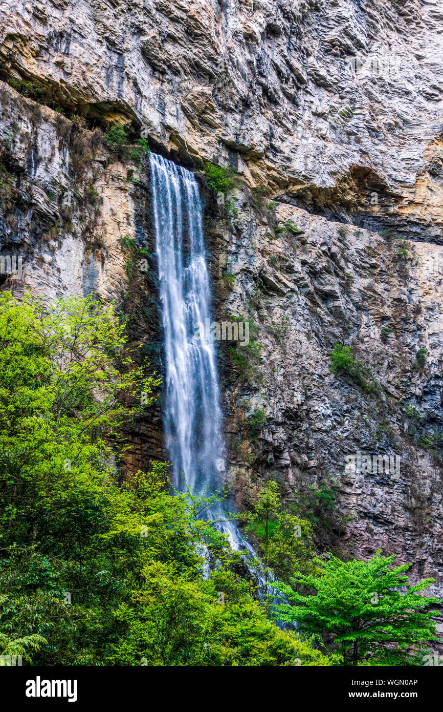 High waterfall falling down from narrow cave in Zhangjiajie in Grand ...