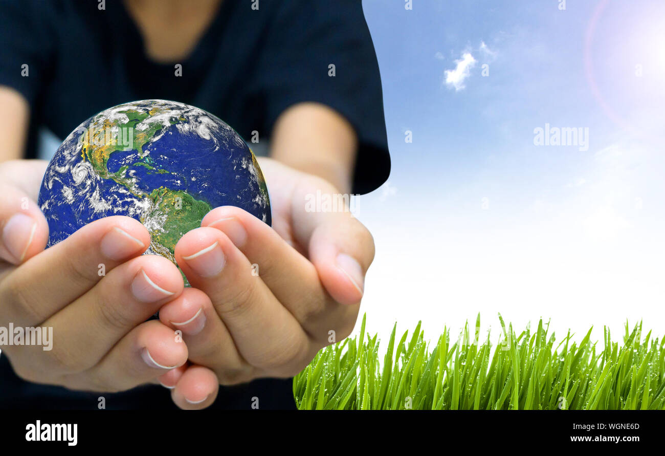 People holding hands earth hi-res stock photography and images - Alamy