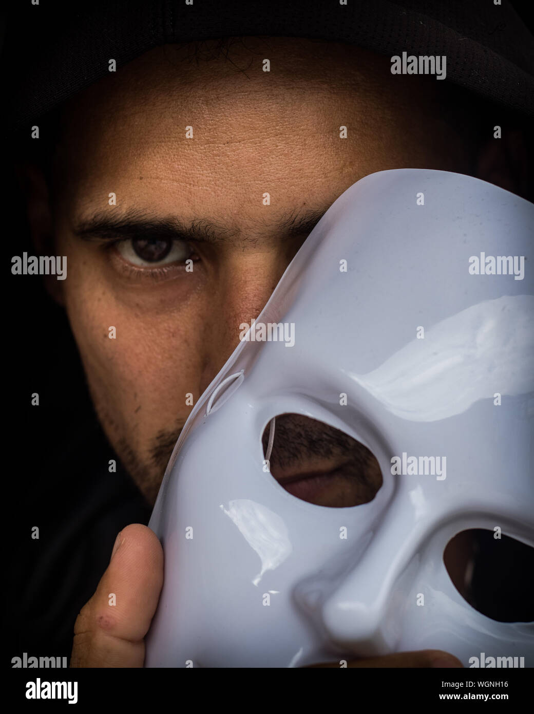 Man holding mask hi-res stock photography and images - Alamy