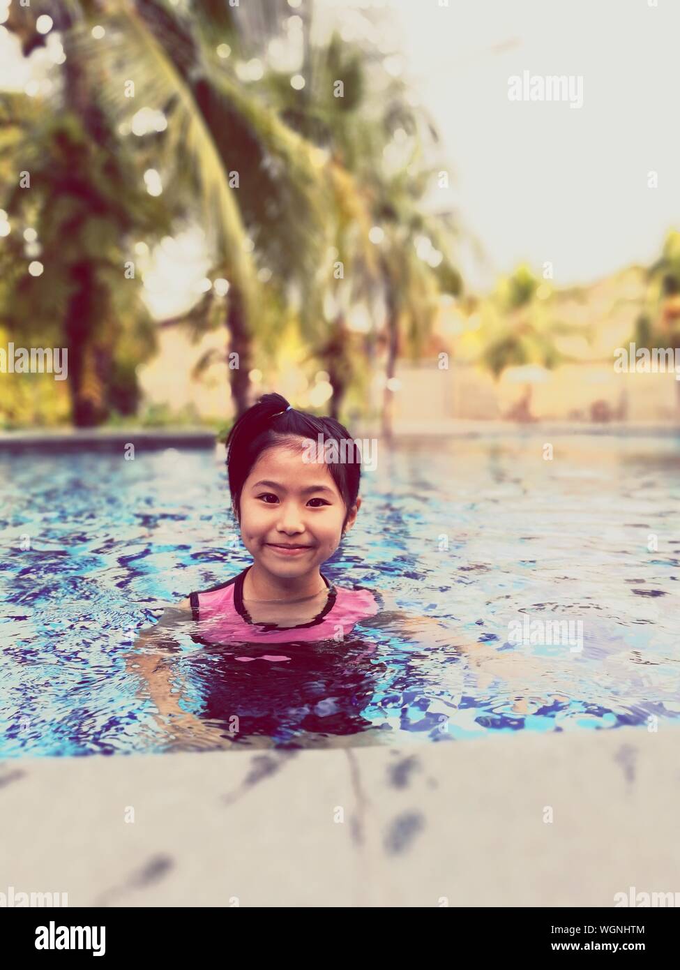 Portrait Of Smiling Girl In Swimming Pool Stock Photo - Alamy