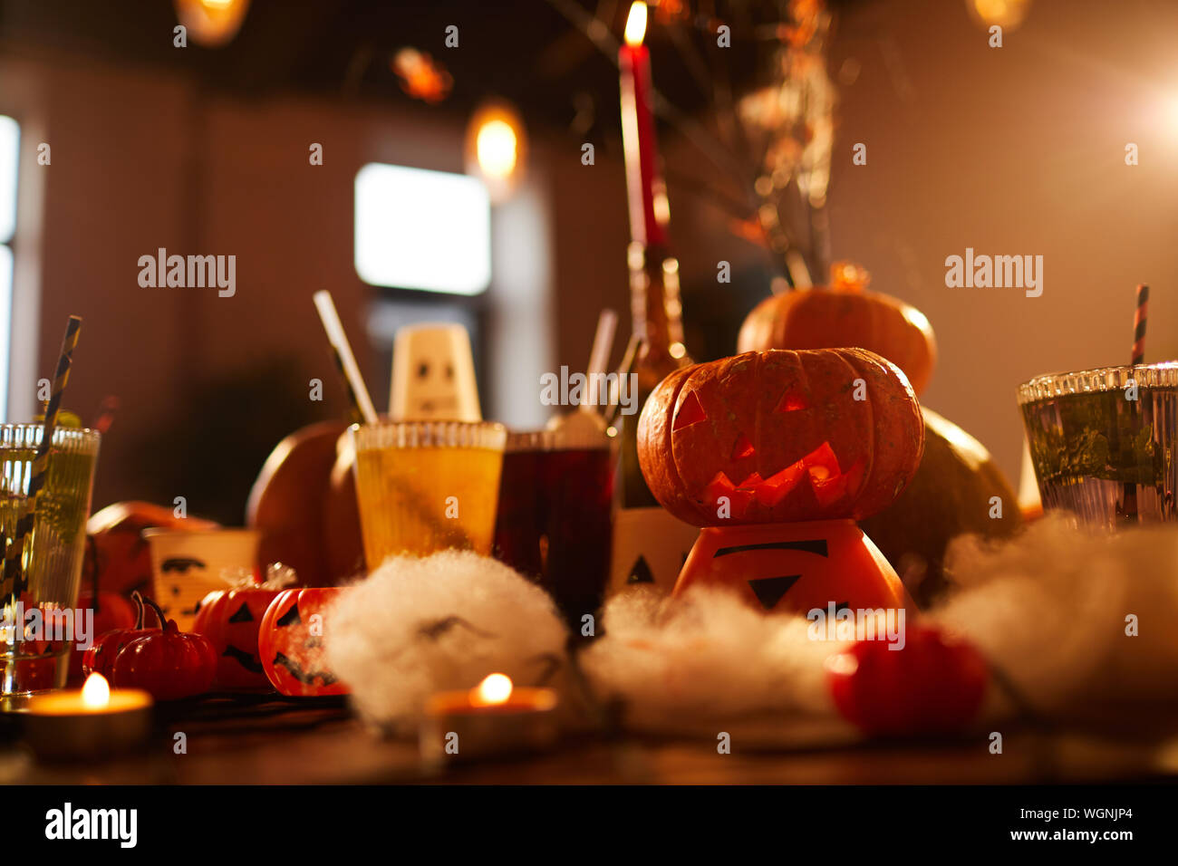 Halloween background of witches table with candles and pumpkins decor ...