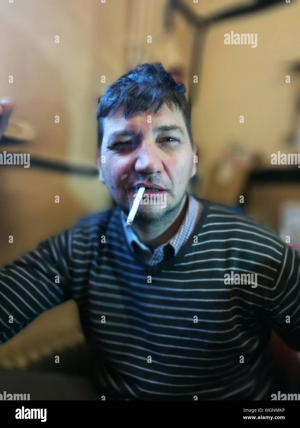 Man smoking cigarette home hi-res stock photography and images - Alamy