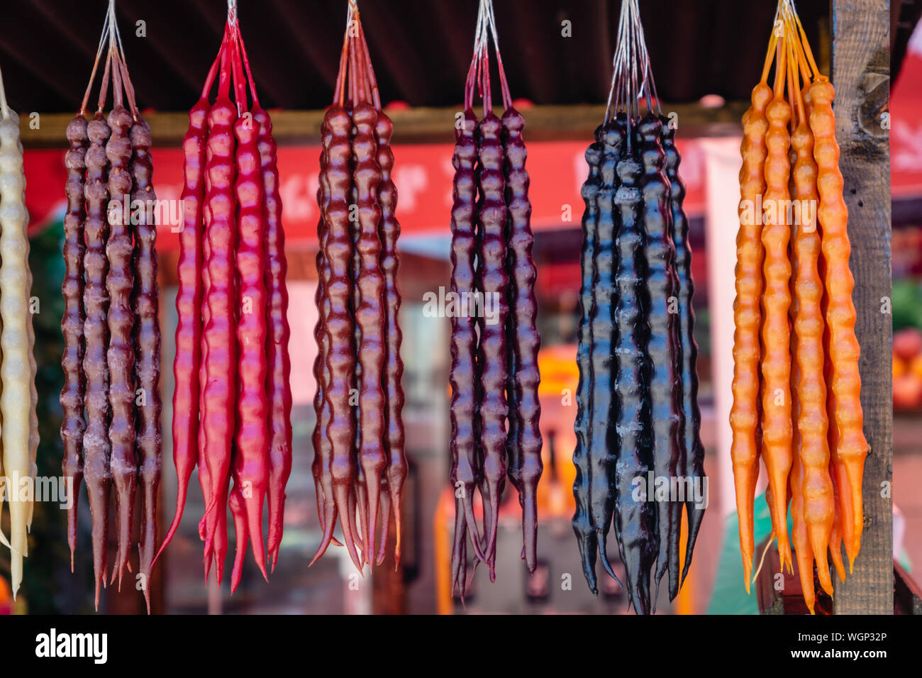 Churchkhela candies hanging in front of market stall in Tbilisi ...