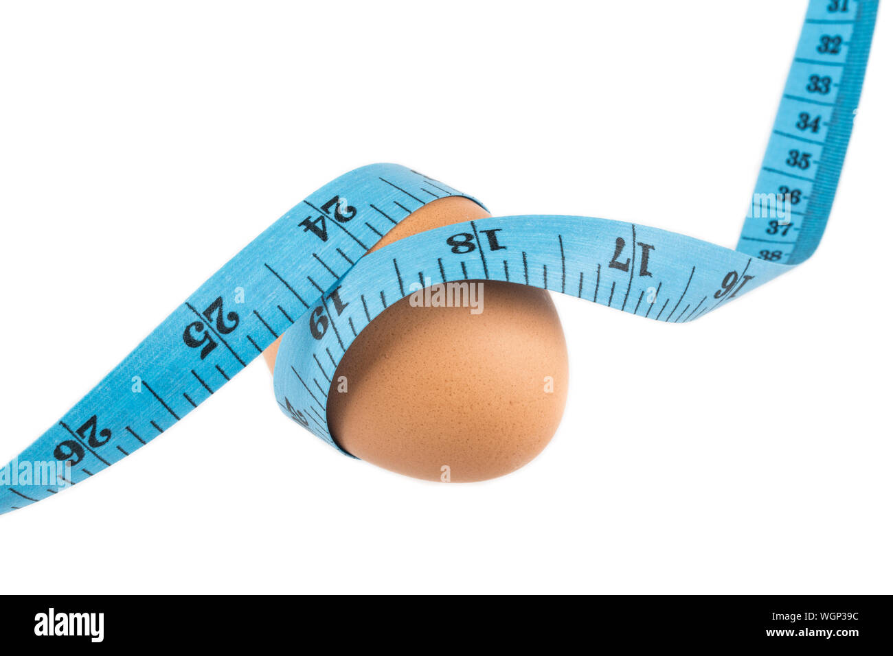 Egg and measuring tape Cut Out Stock Images & Pictures - Alamy