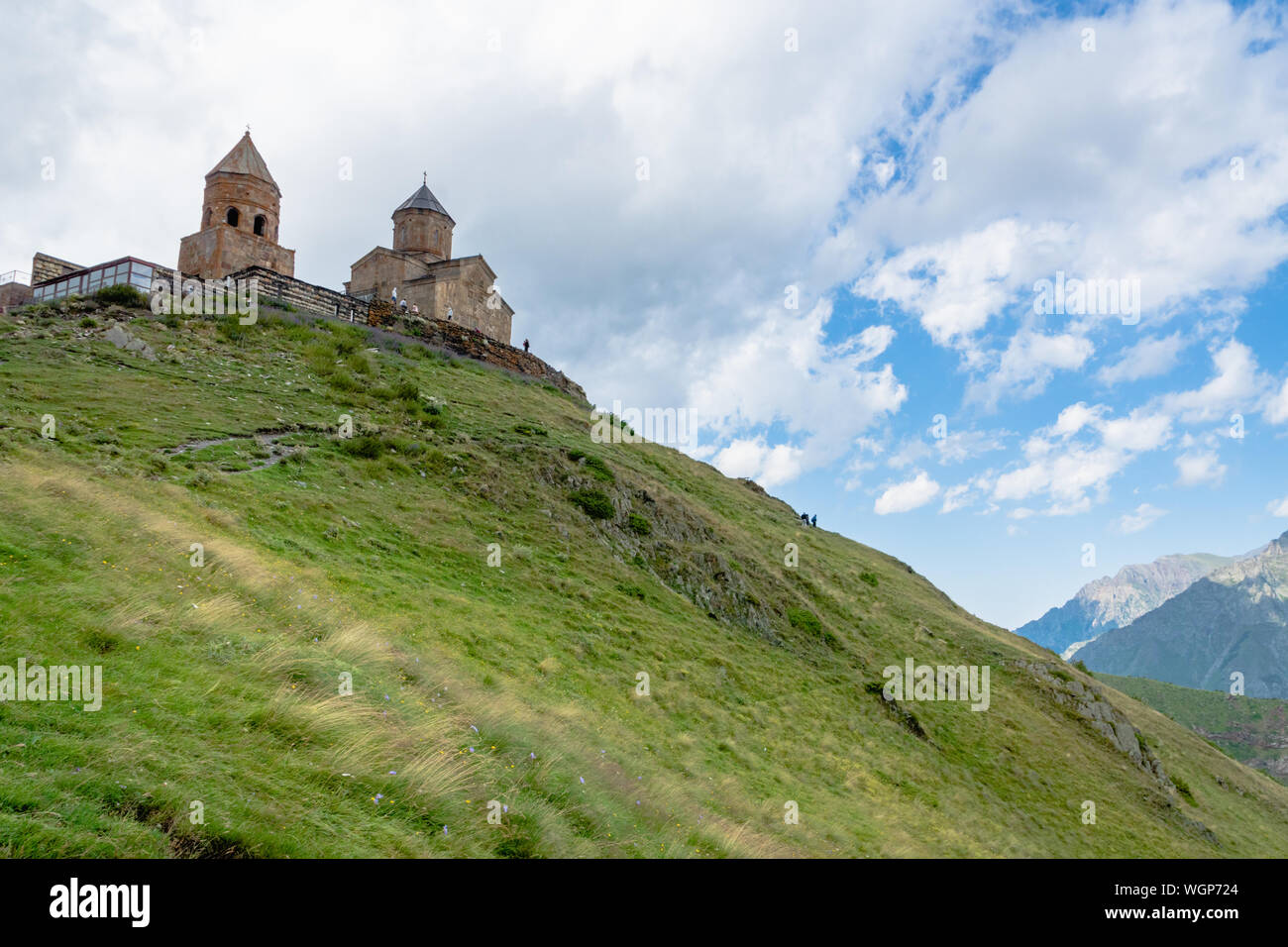 Gergeti Trinity Church or Tsminda Sameba, dramatic landscaoe with ...