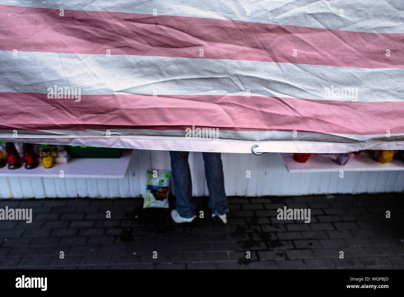 Low Section Of Man Standing At Market Stall Stock Photo - Alamy