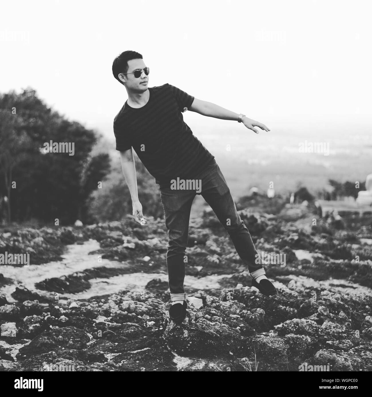 Young man balancing Black and White Stock Photos & Images - Alamy