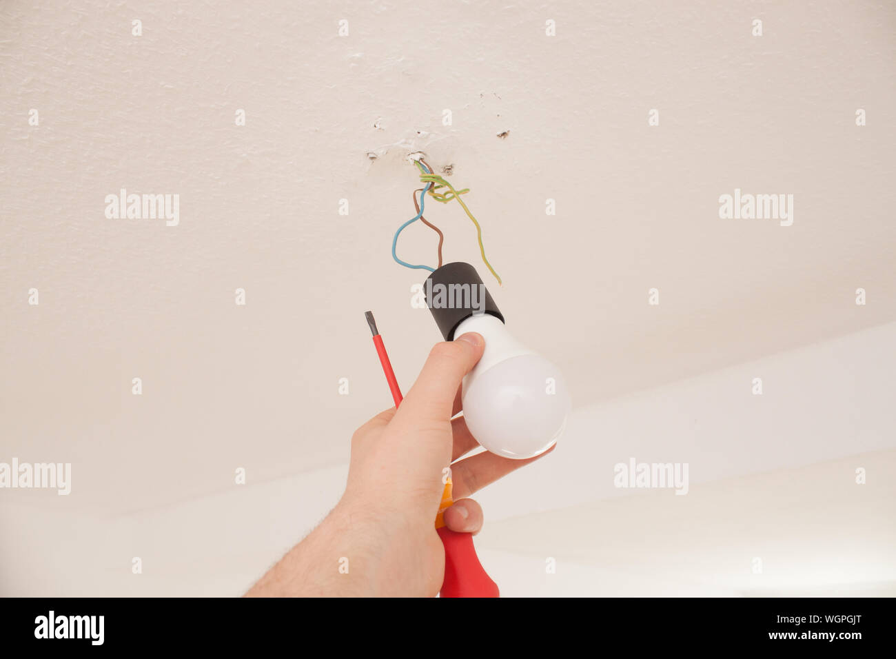 Adjusting light hi-res stock photography and images - Alamy
