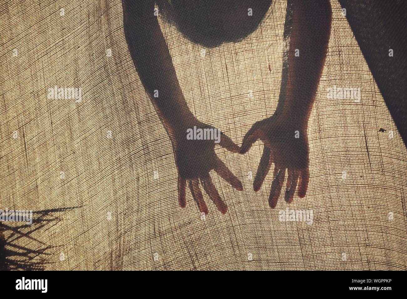 Hand behind fabric hi-res stock photography and images - Alamy