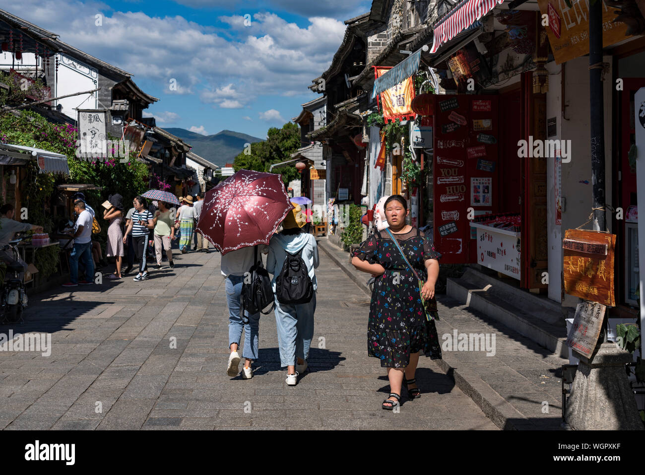 People on street in Dali Ancient City (Dali Old Town). Located in Dali ...