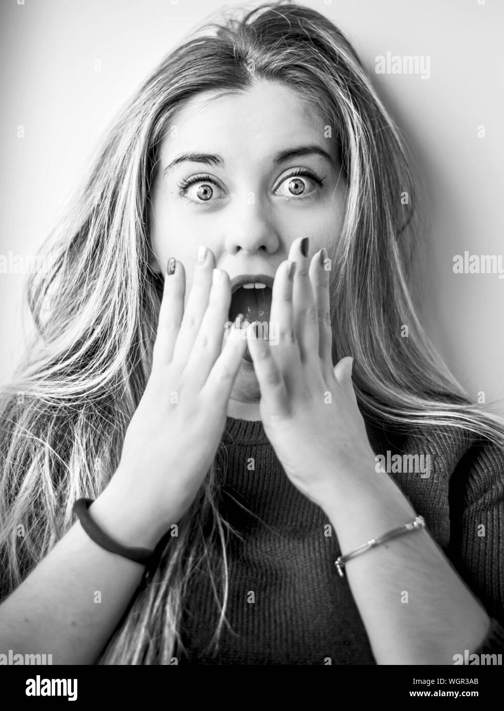 Surprised blond woman hi-res stock photography and images - Alamy