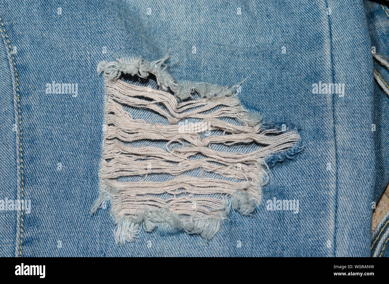 Torn thread hi-res stock photography and images - Alamy