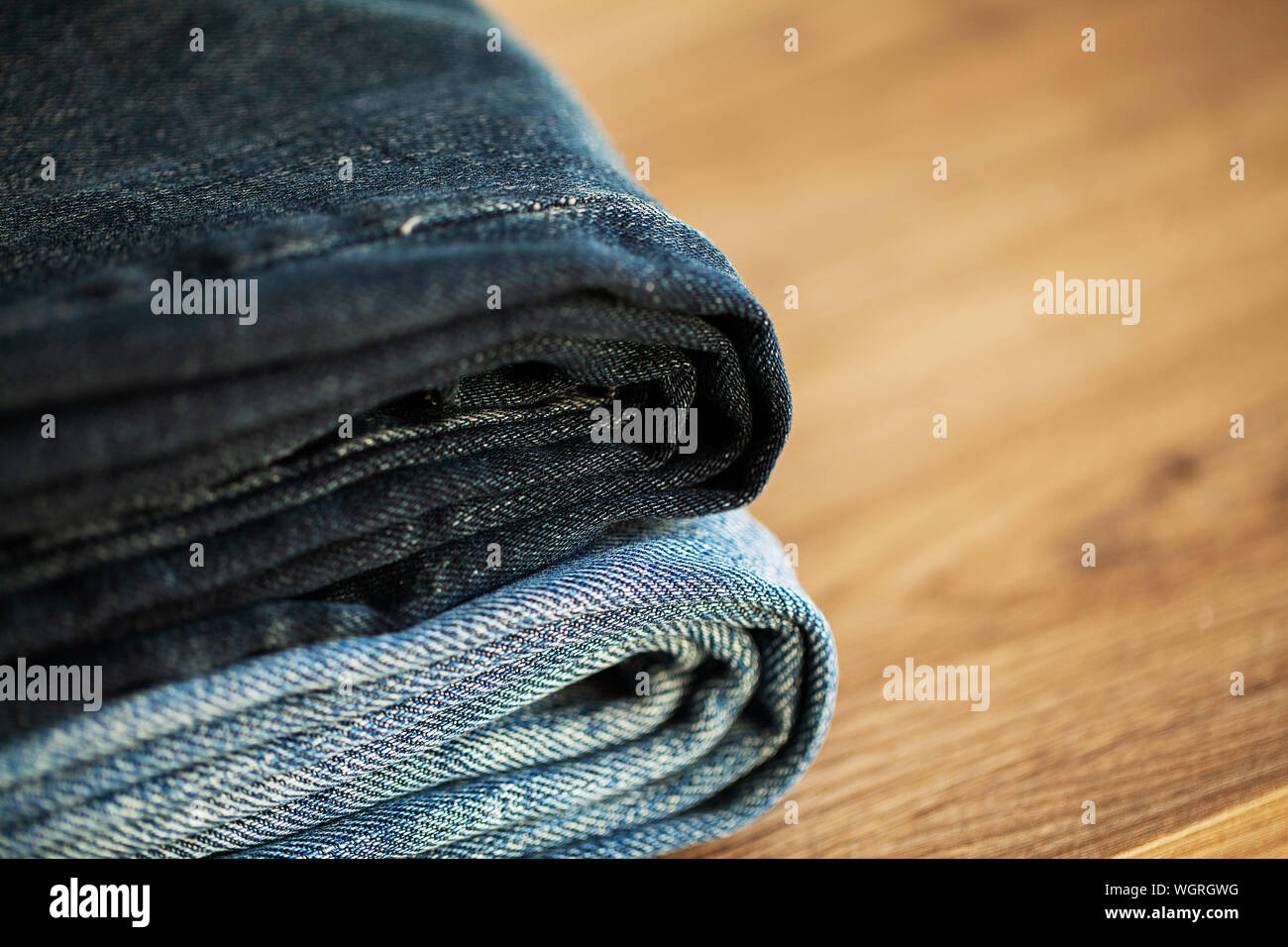 Denim blue jeans stack texture background closeup Stock Photo - Alamy