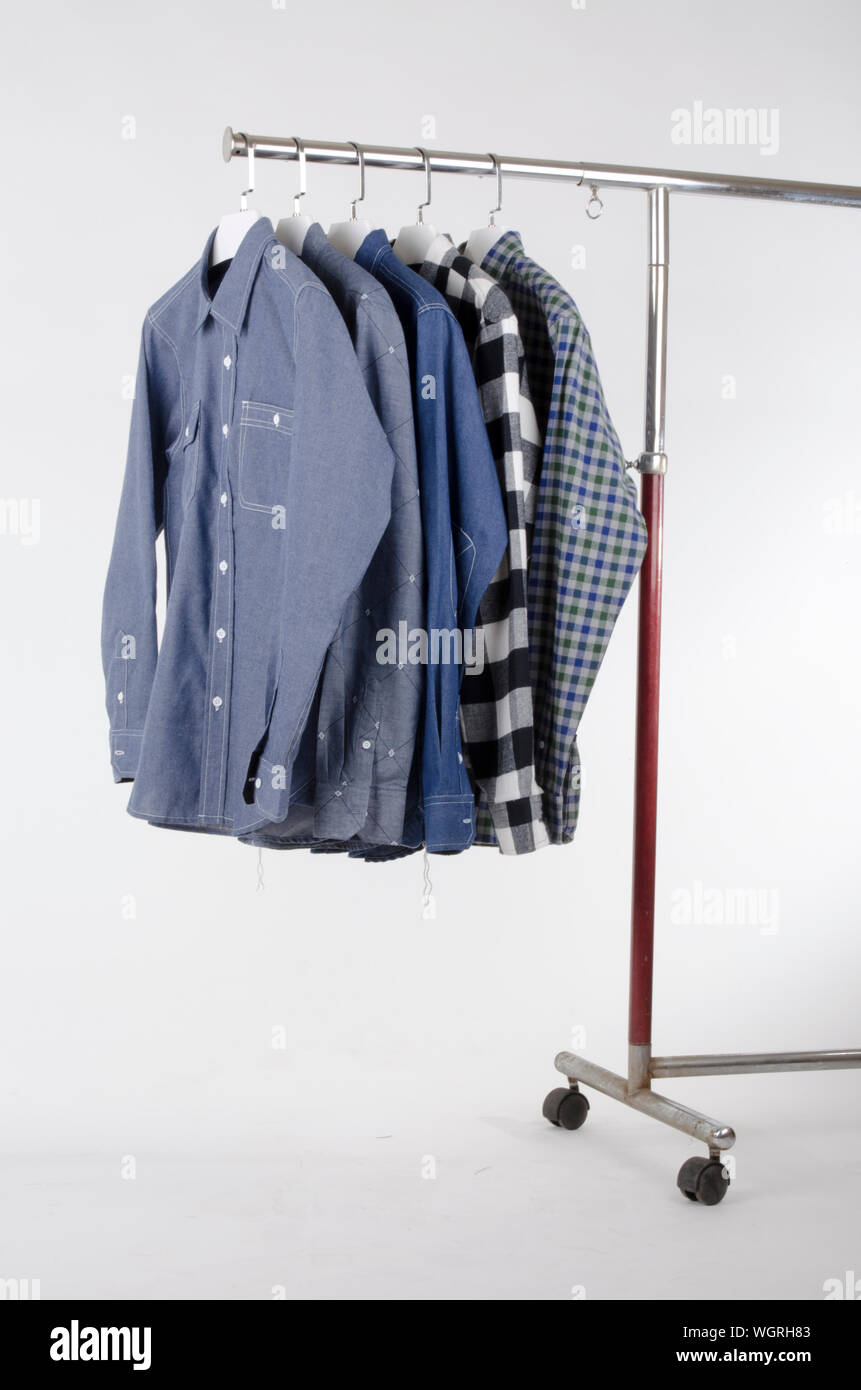 White shirts hanging on rack hi-res stock photography and images - Alamy