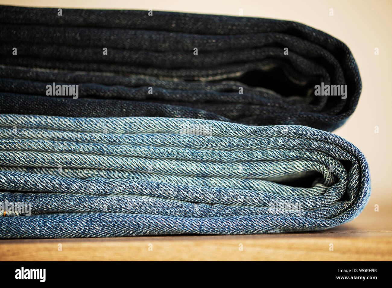 Denim blue jeans stack texture background closeup Stock Photo - Alamy