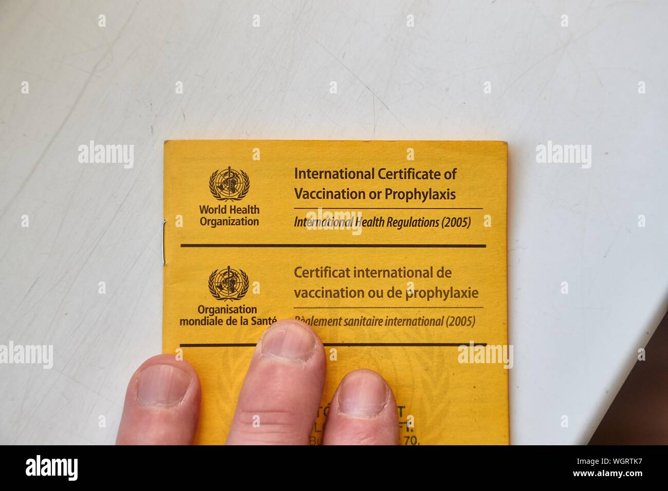 Vaccination certificate shown at a desk Stock Photo - Alamy