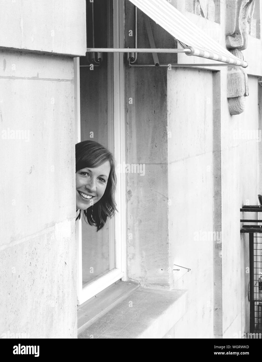 Person looking through window exterior Black and White Stock Photos ...