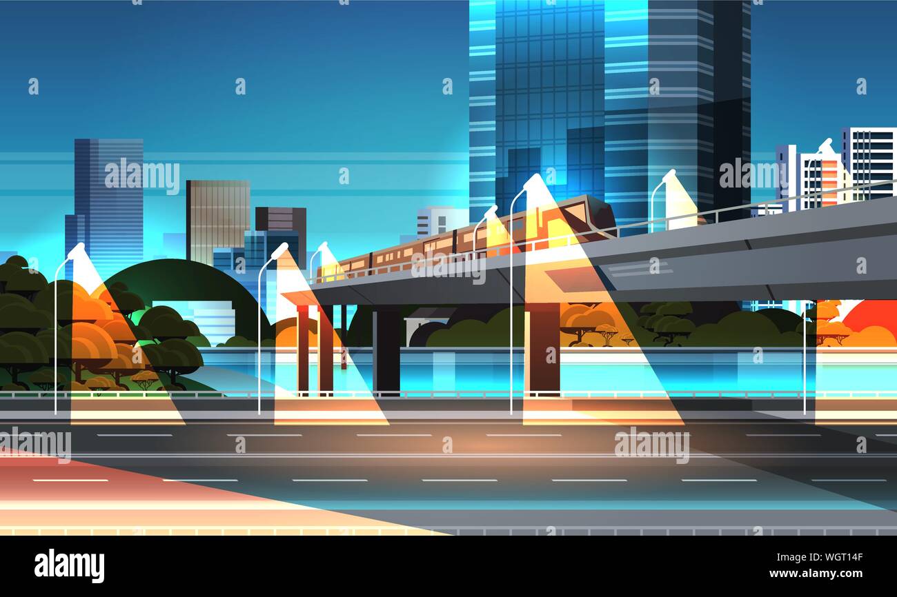 highway road night city street with modern skyscrapers train on railway ...