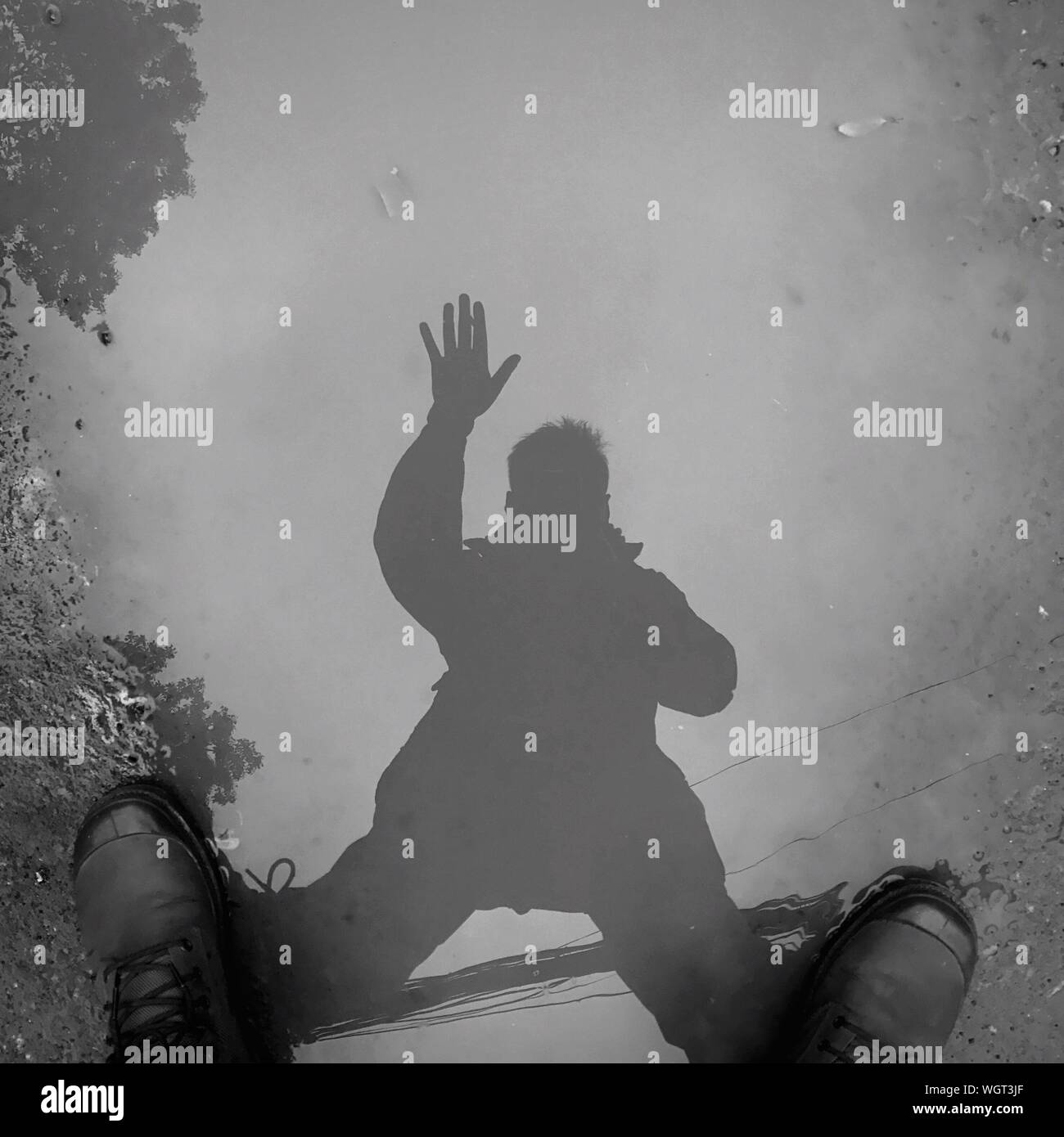 Man Standing In Puddle And Street High Resolution Stock Photography and ...