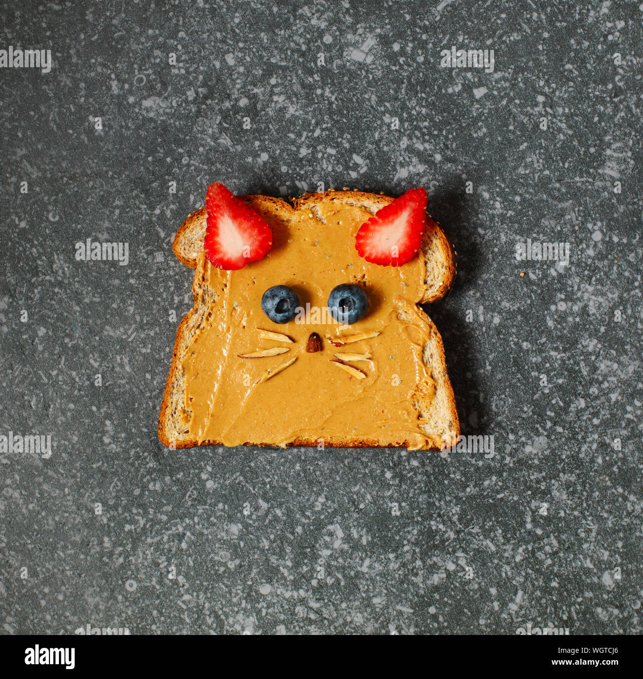 Funny animal face toast with nut spread, strawberry and blueberry Stock ...