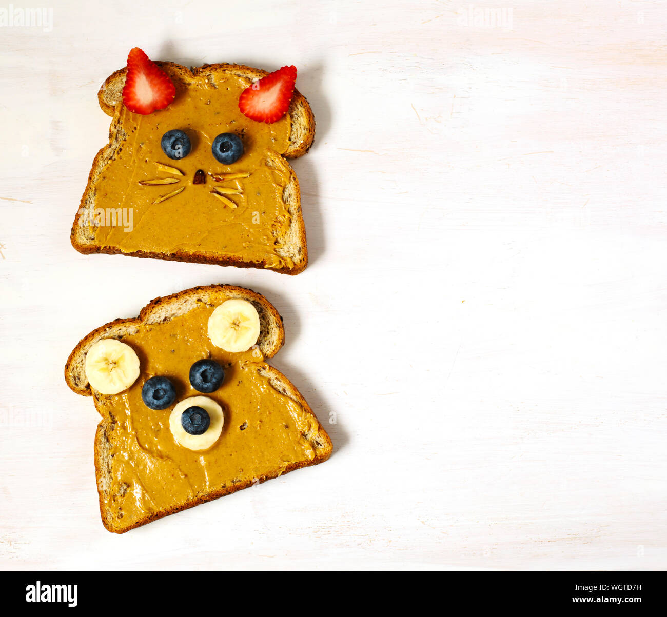 Funny animal face toast with nut spread, strawberry and blueberry Stock ...
