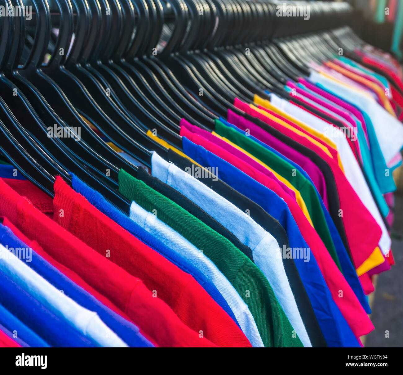 T shirts hanging on rack hi-res stock photography and images - Alamy