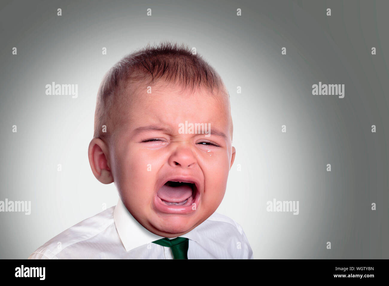 Close-up Of Baby Boy Crying Against White Background Stock Photo - Alamy