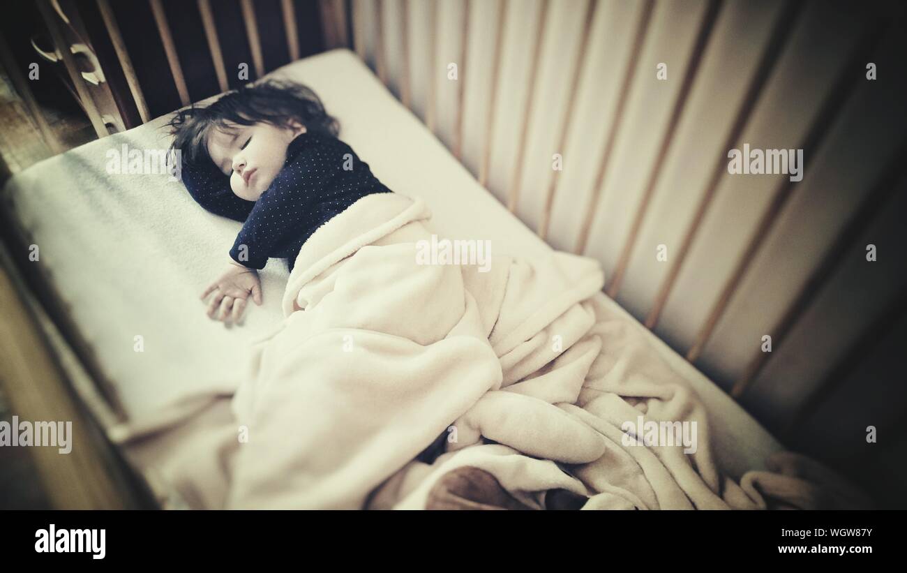 Child resting in bed hi-res stock photography and images - Alamy