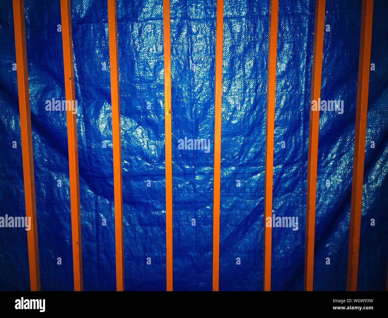 Blue plastic tarpaulin hi-res stock photography and images - Alamy