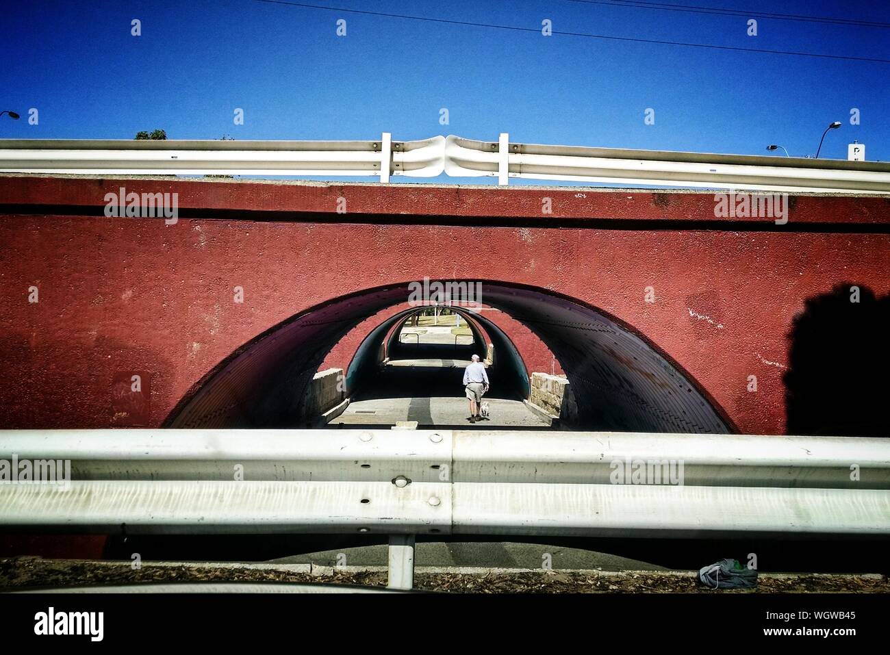 Walking under arch hi-res stock photography and images - Alamy