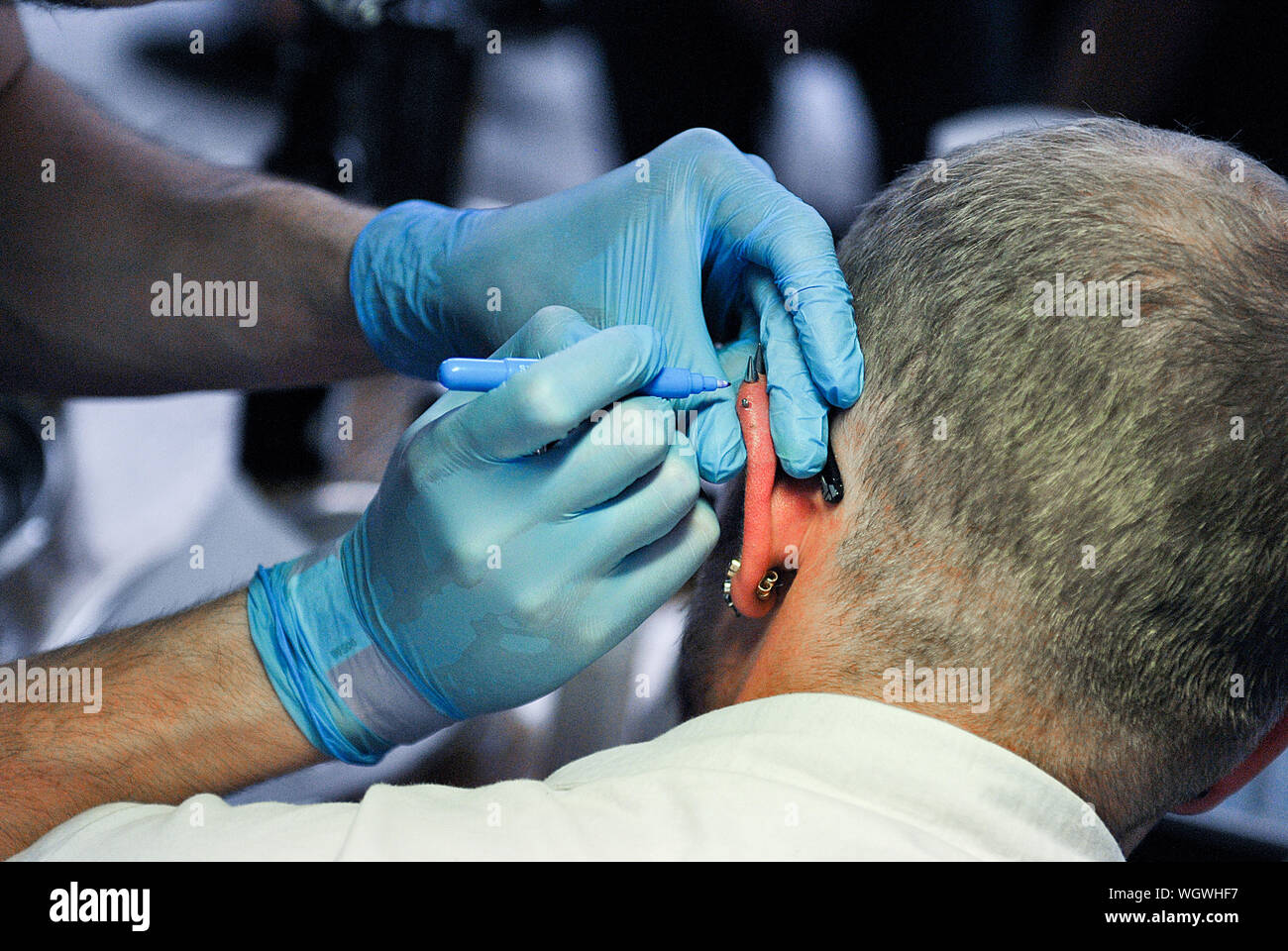 Piercing ear hi-res stock photography and images - Alamy