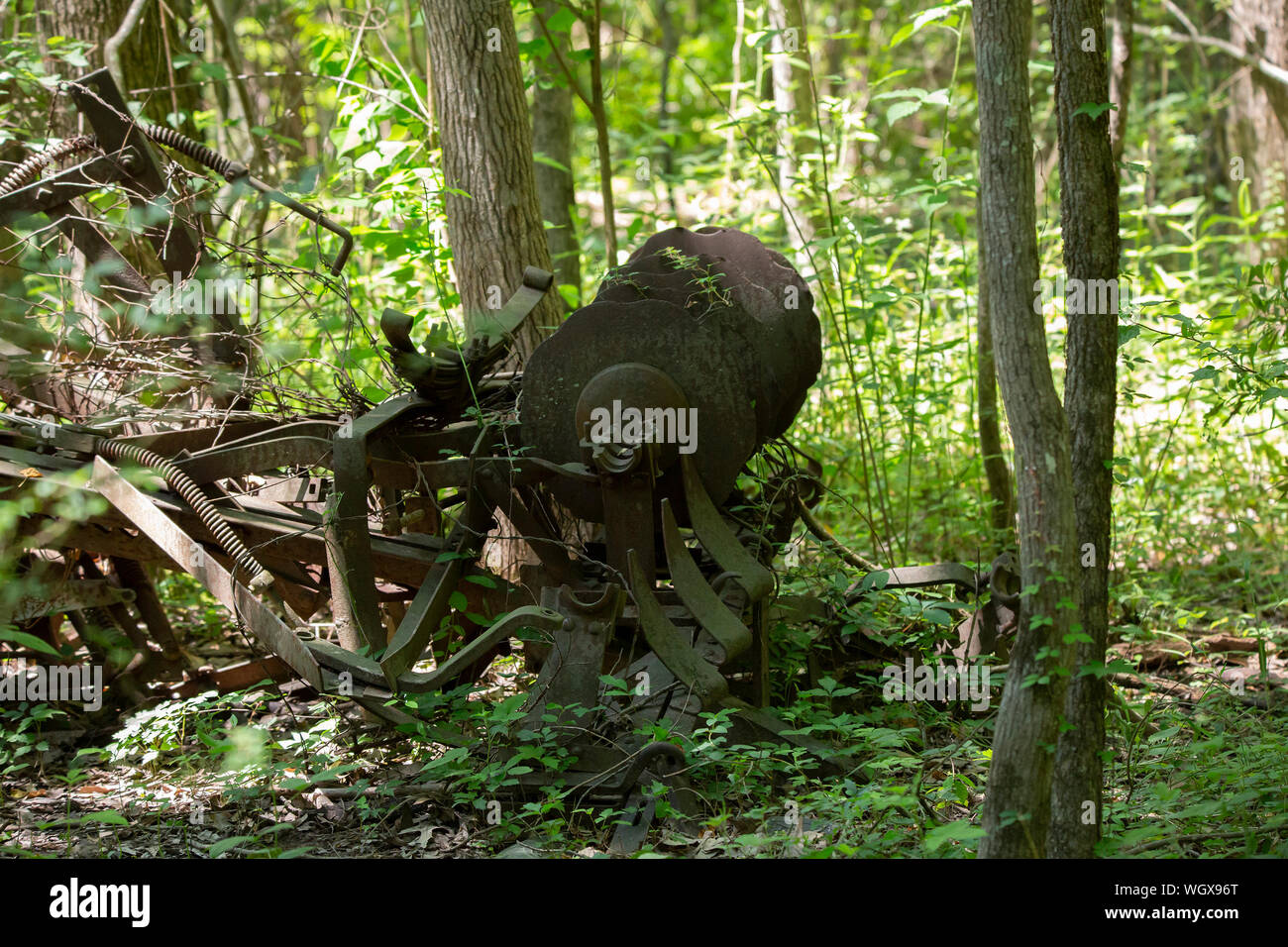 Large, rusty old equipment littering a natural habitat Stock Photo - Alamy