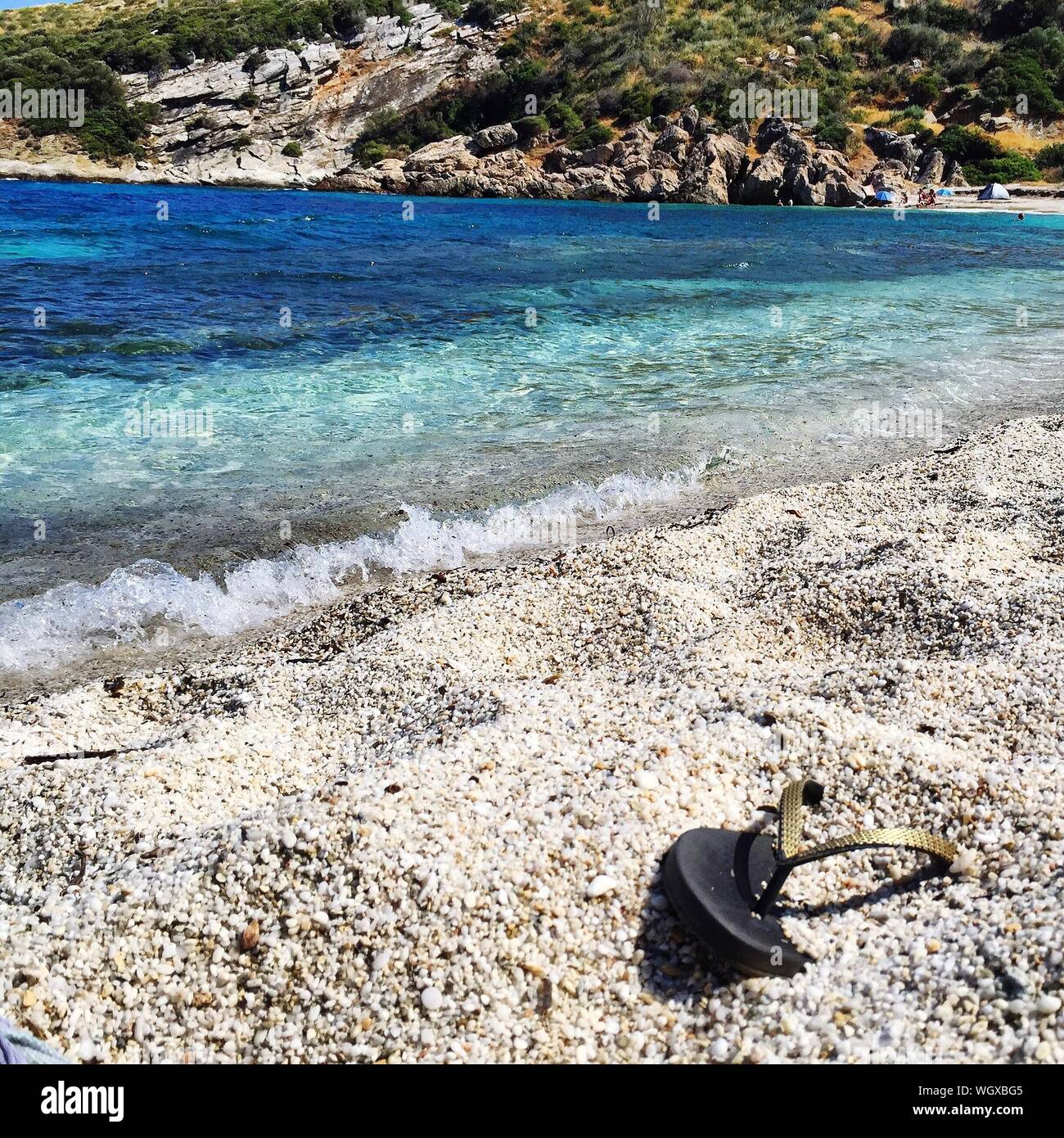 Flip-flop In Sand At Beach Stock Photo - Alamy