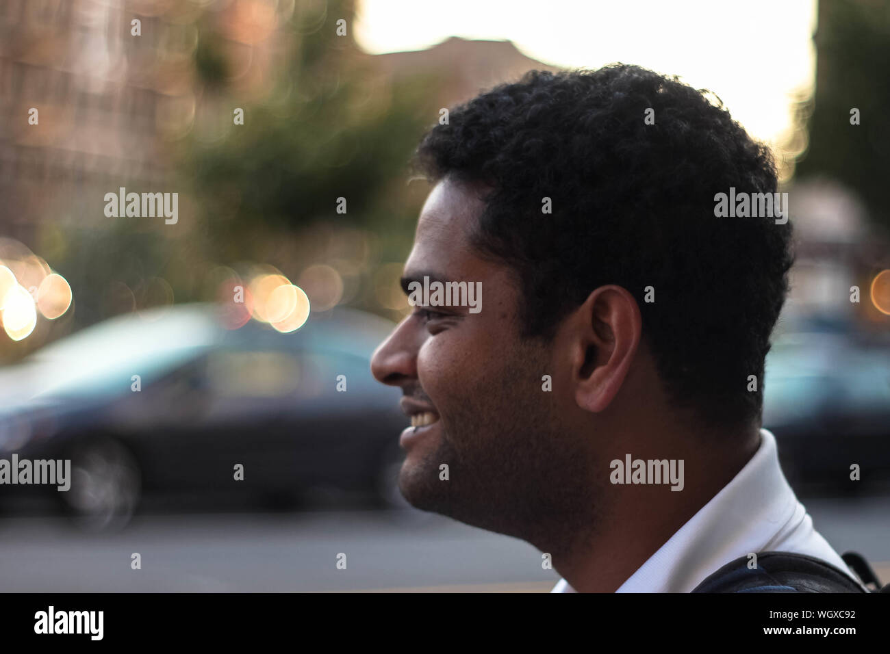 Indian man smiling side profile hi-res stock photography and images - Alamy