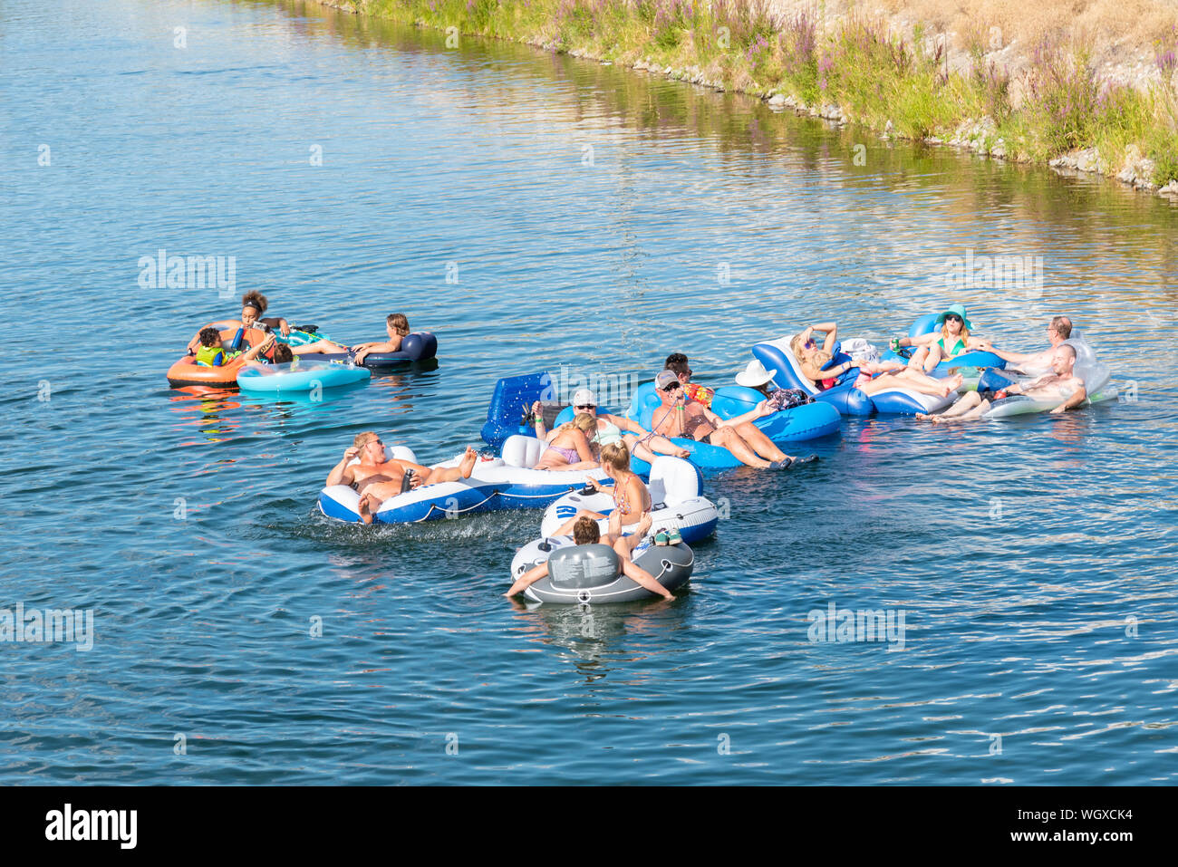 Inner tube floating down river hi-res stock photography and images - Alamy