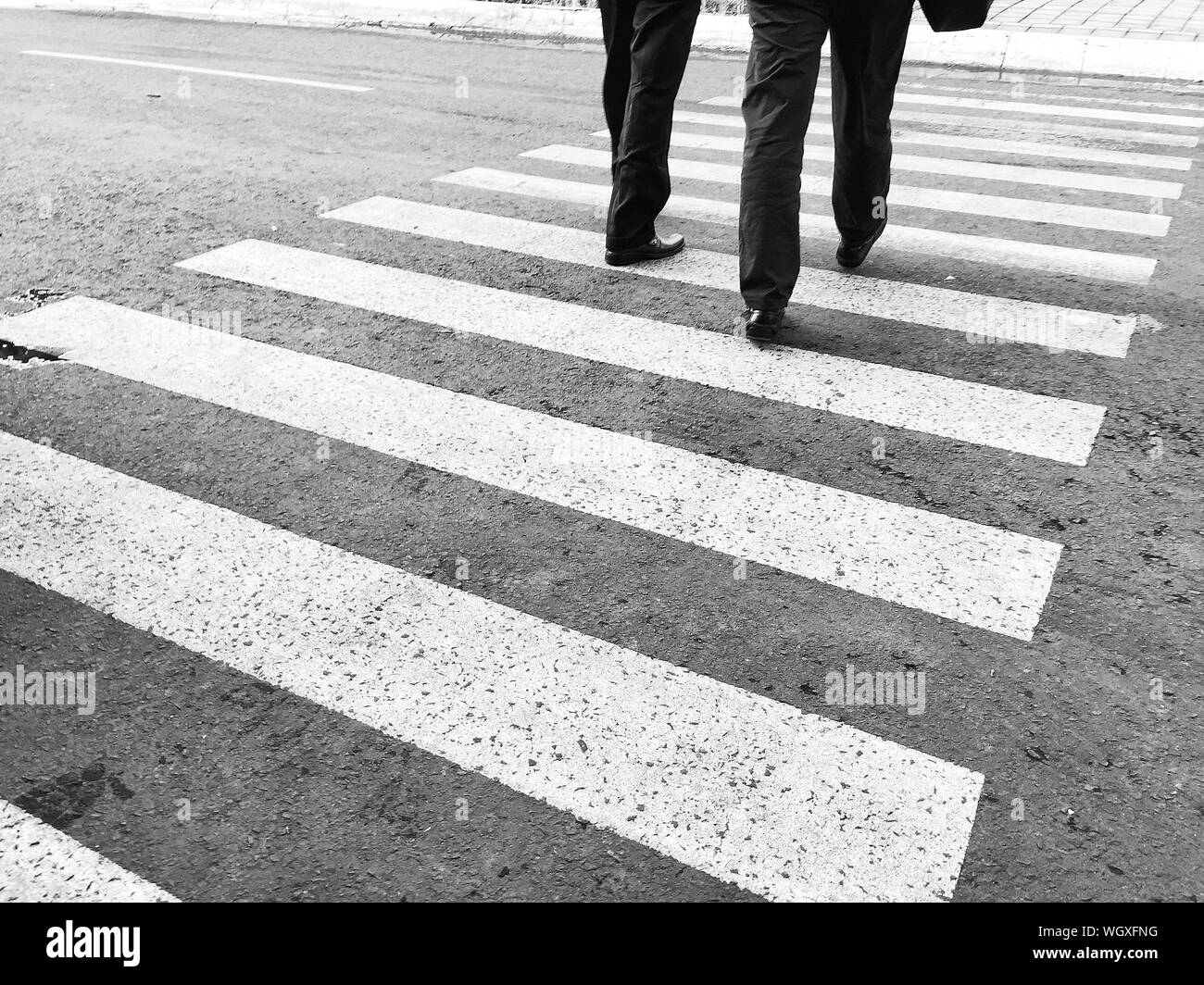 Two men crossing road hi-res stock photography and images - Alamy