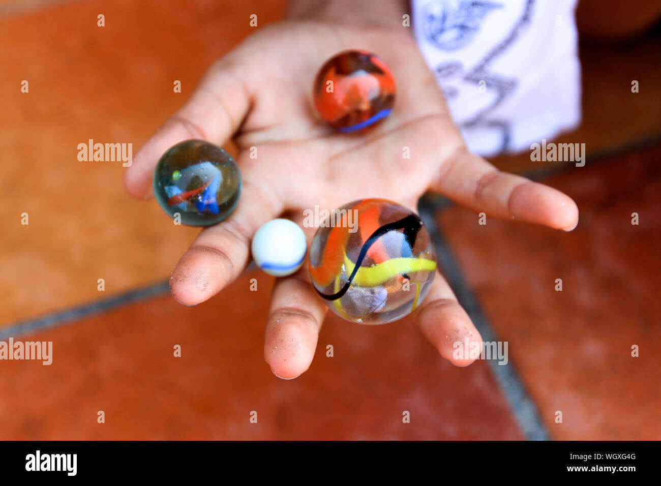 Hand Holding Marbles High Resolution Stock Photography and Images - Alamy
