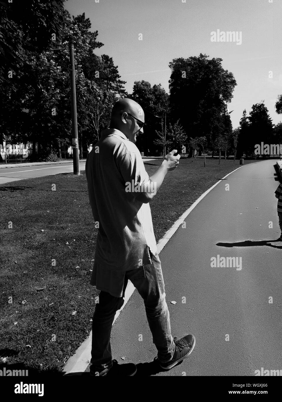 Man walking side view sunlight hi-res stock photography and images - Alamy