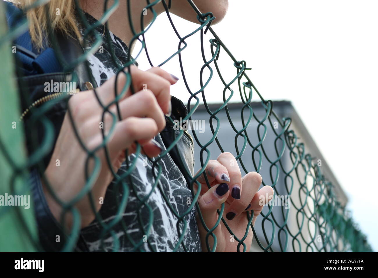 Woman hand wire fence hi-res stock photography and images - Alamy