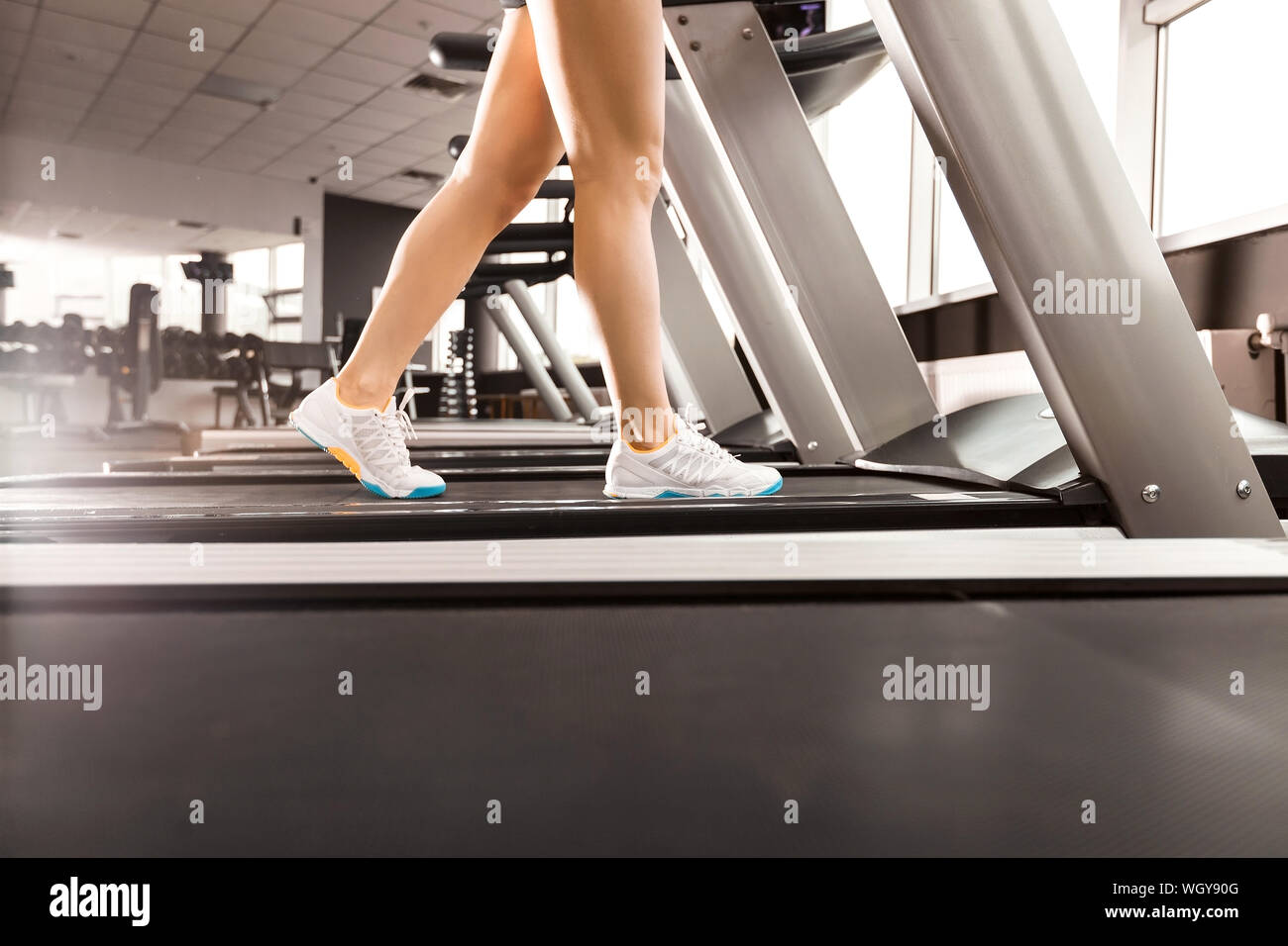 womans legs walking at the treadmill in the gym Stock Photo - Alamy